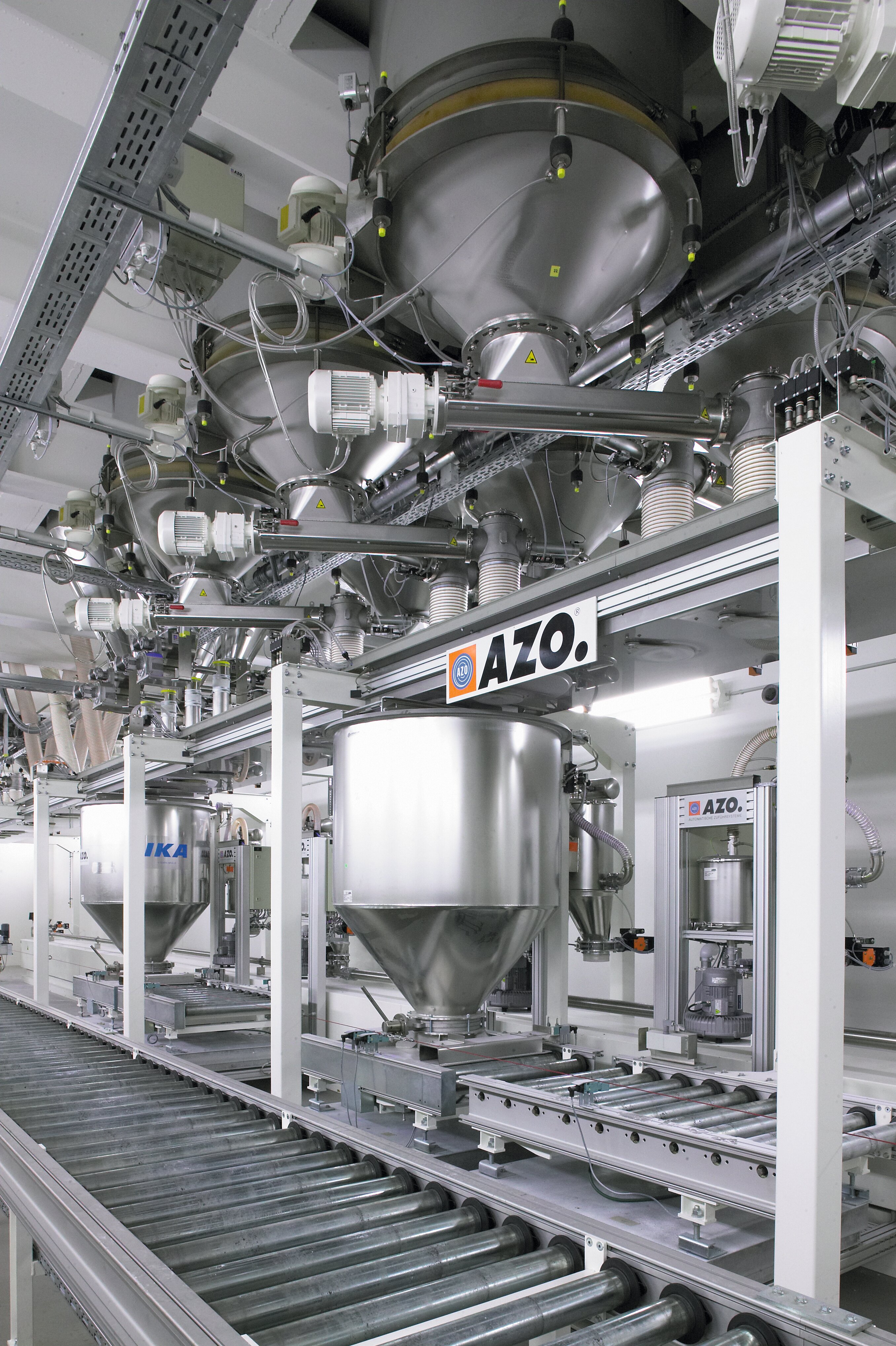 Raw material handling for powder coating manufacturing